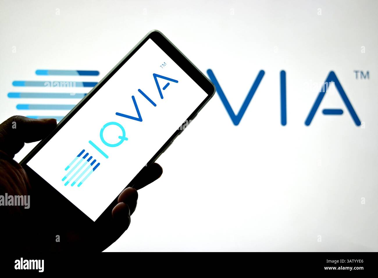 In this photo illustration, an IQVIA logo is seen displayed on a ...