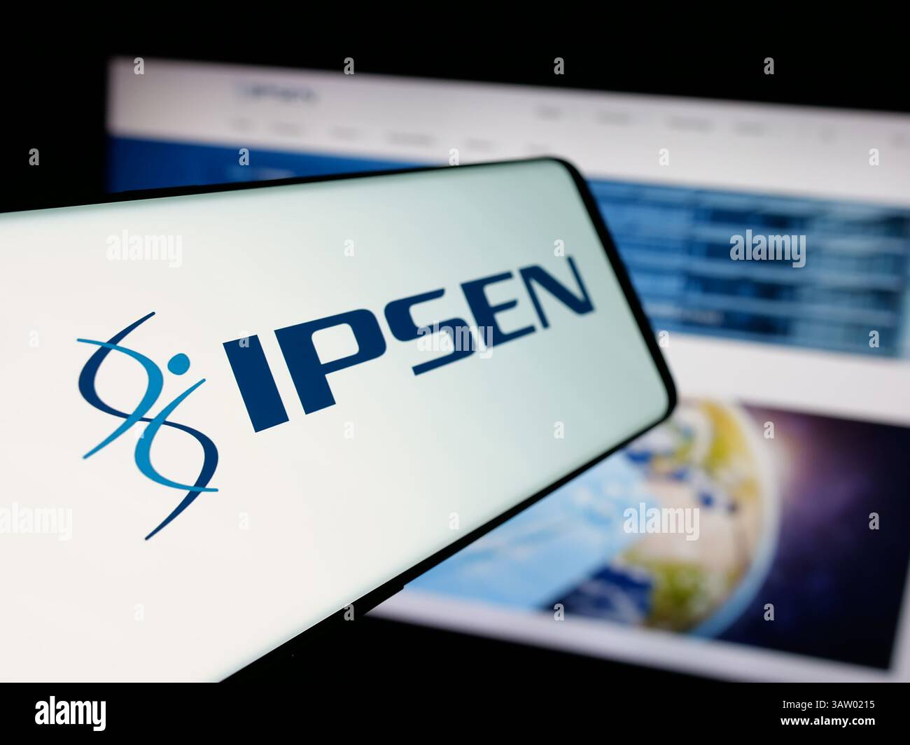 In this photo illustration, a smartphone with the logo of French biopharmaceutical company Ipsen ...