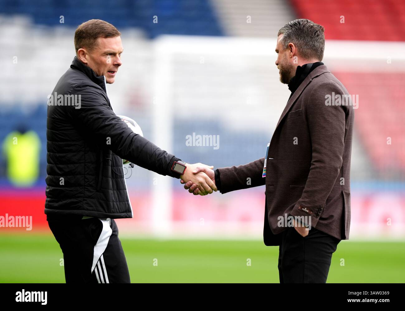 Referee John Beaton shakes hands with Aberdeen Manager Jimmy Thelin ...