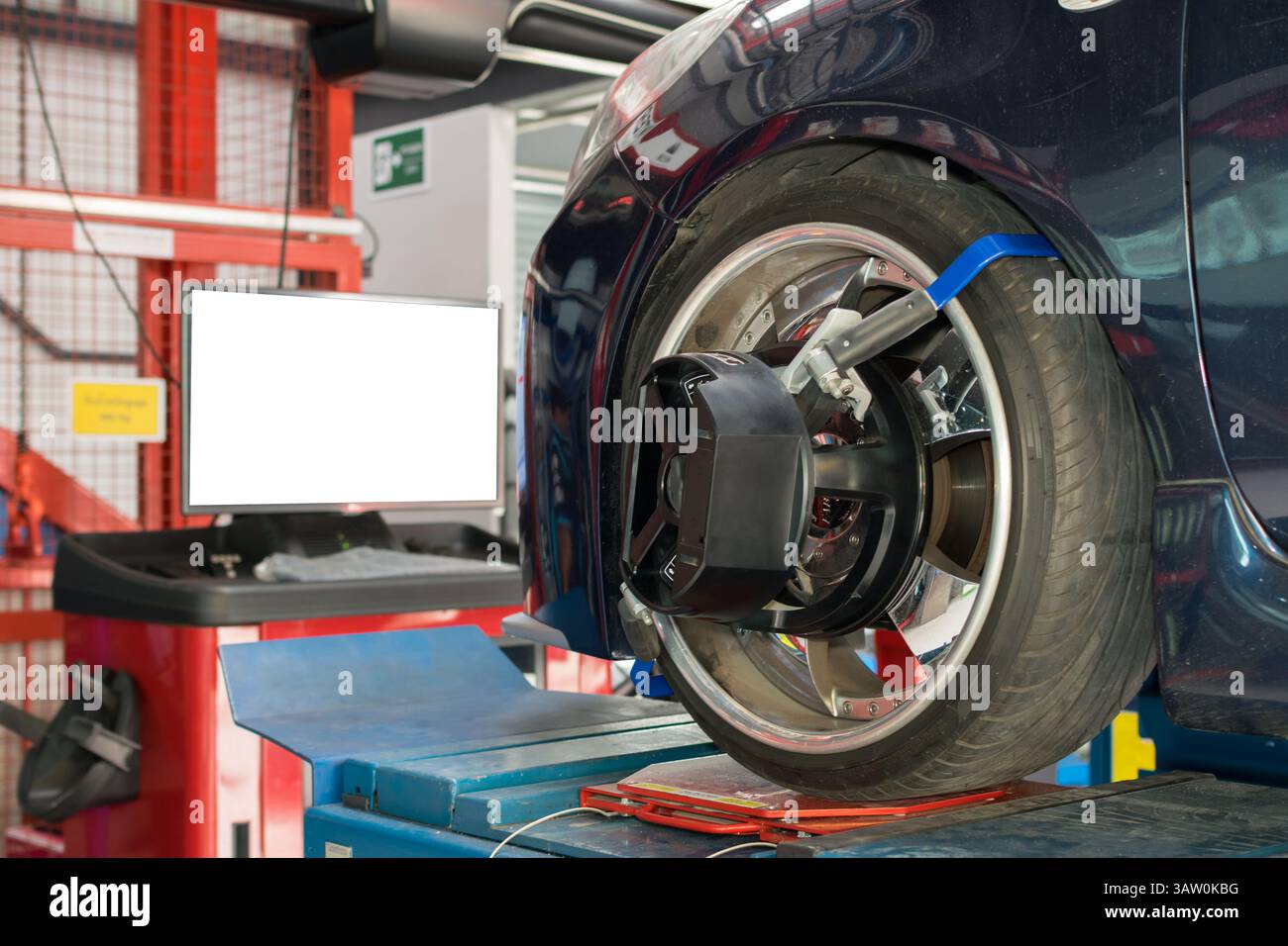 Checking suspension in a car by tool electronic tools at car garage ...