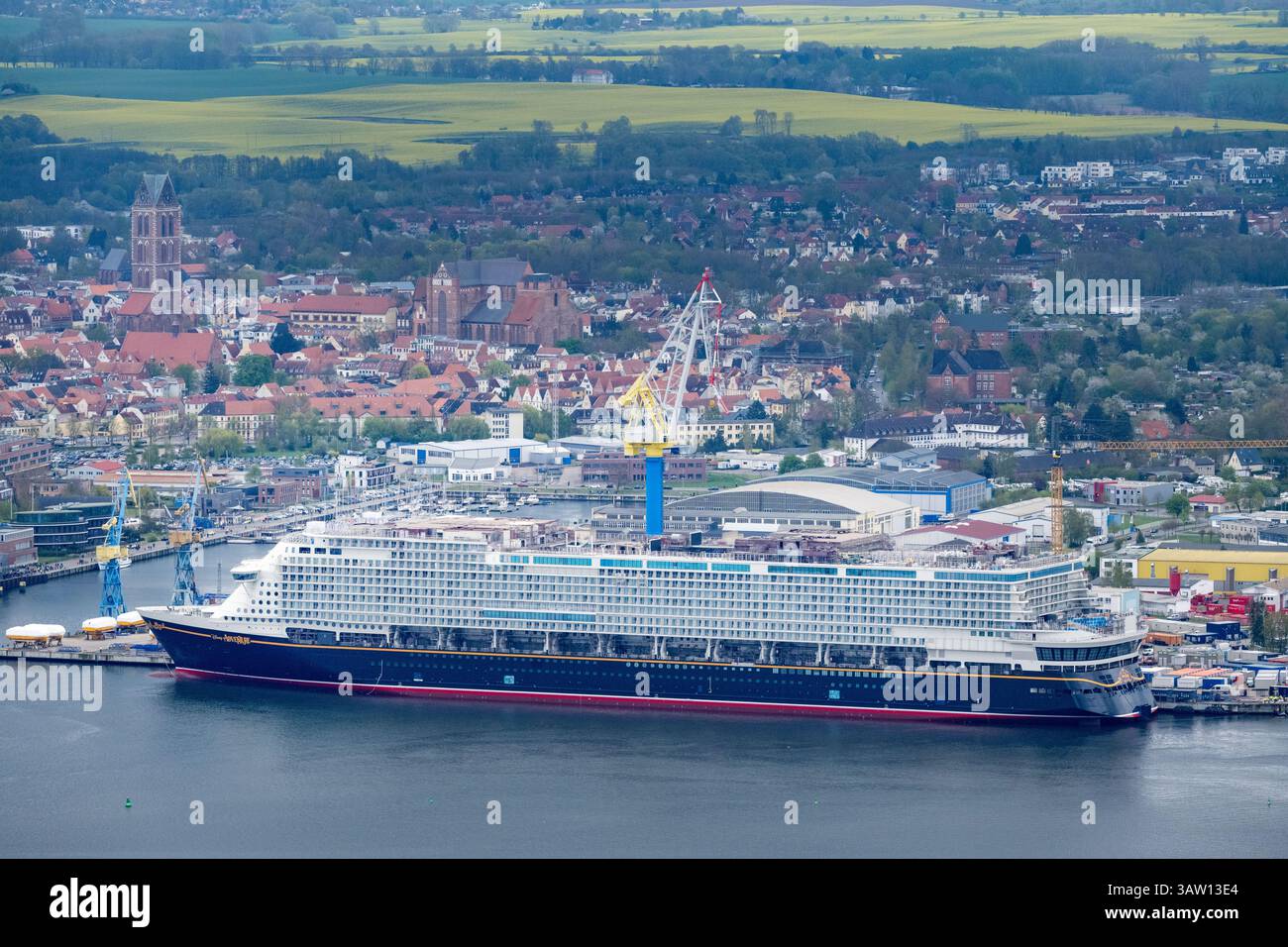 Wismar, Germany. 19th Apr, 2025. The cruise ship "Disney Adventure" is ...