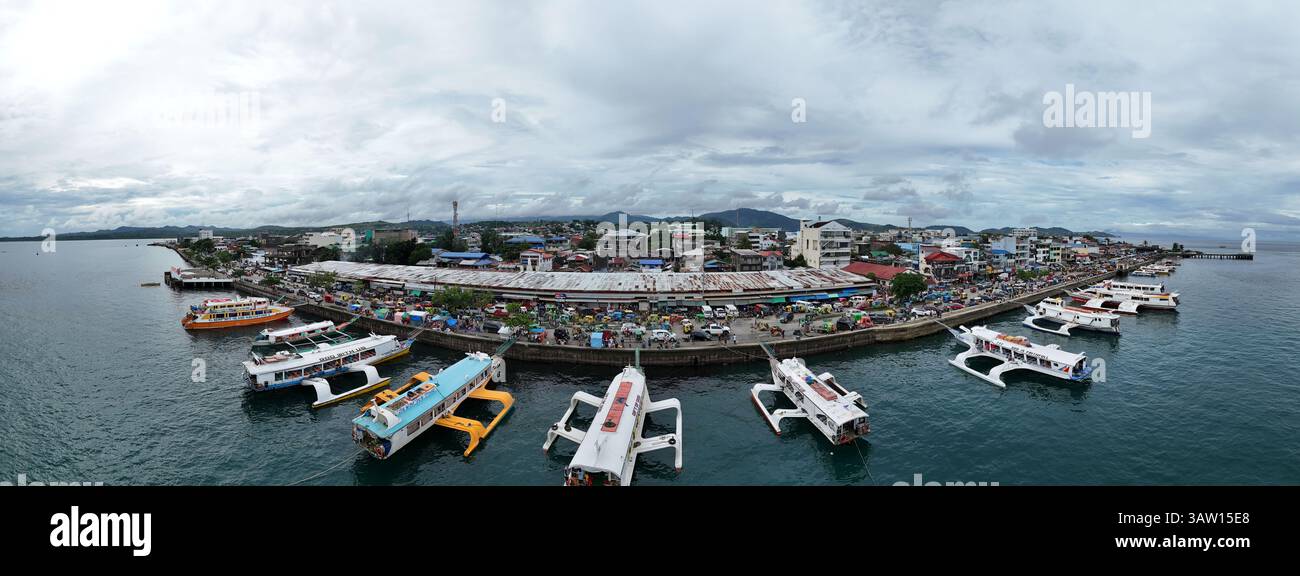 Panorama of Surigao City Boulevard lined with passenger ferries and ...