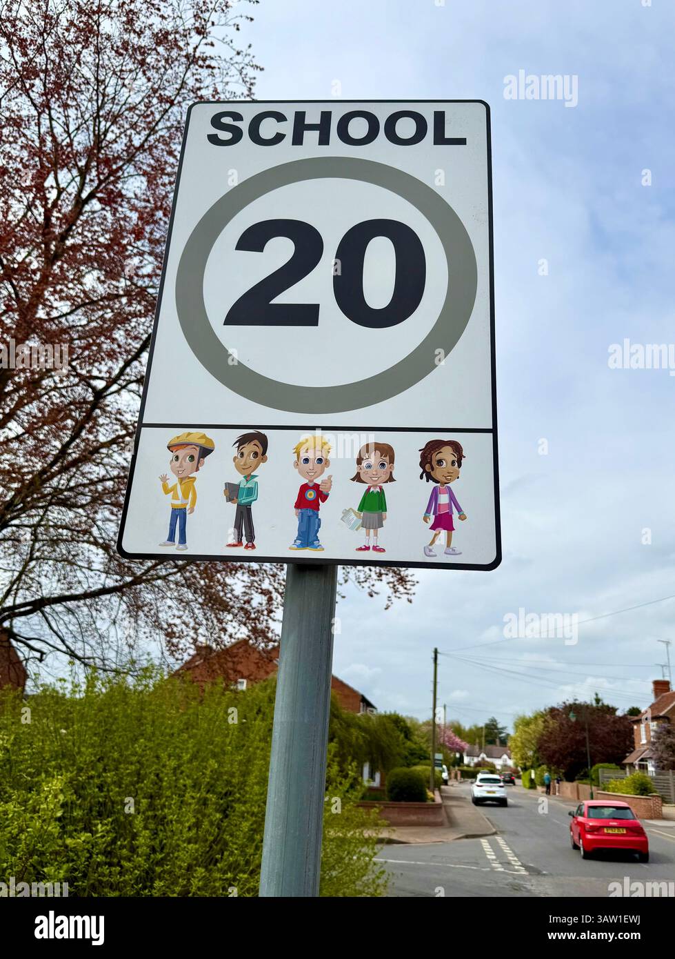 A 20 MPH speed limit sign outside a school in England, U.K Stock Photo ...