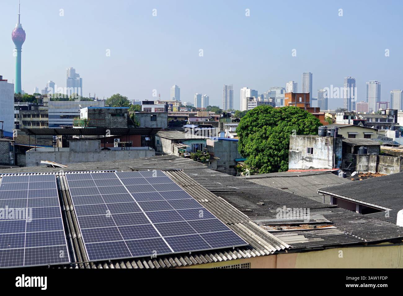 solar panels on a roof in front of the lotus tower in colombo Stock ...