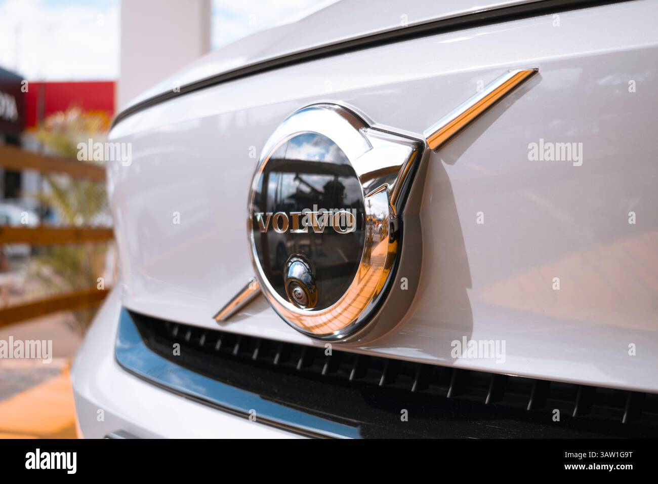 Volvo logo, prominently displayed on the hood of a white vehicle, with ...