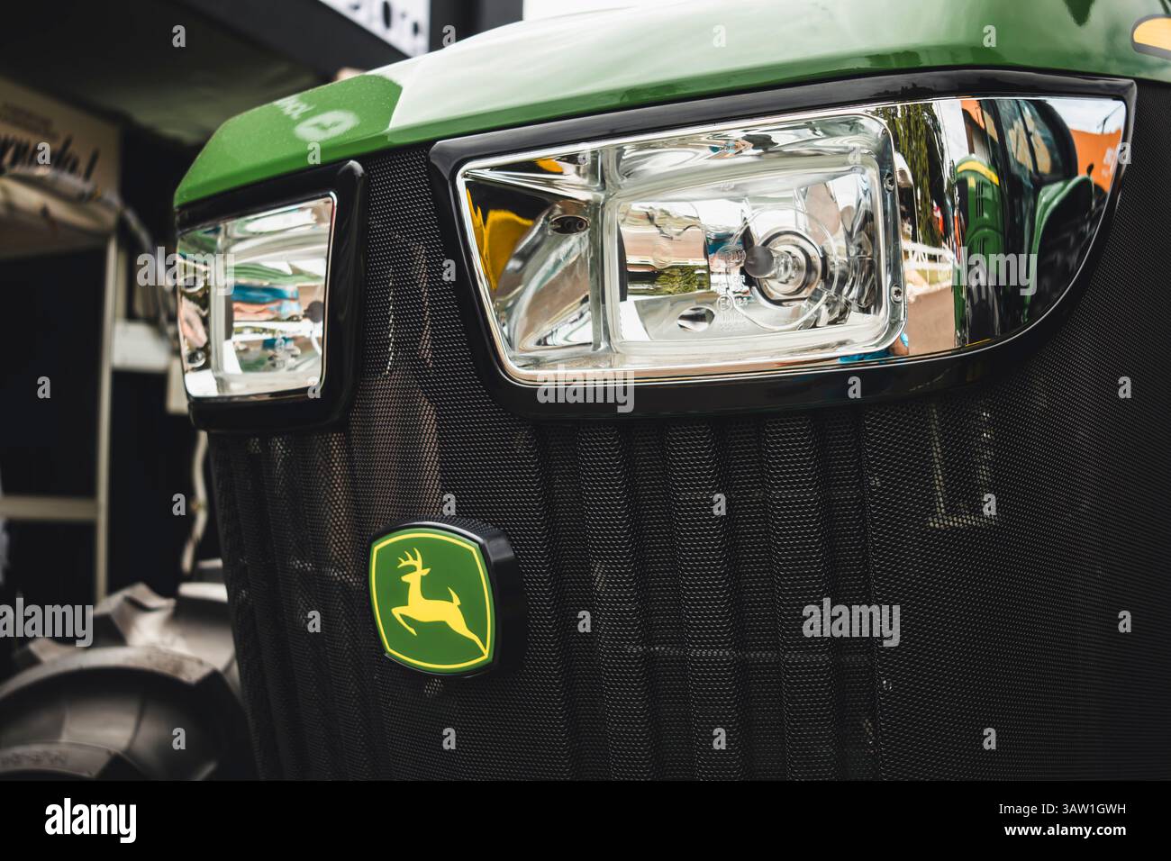 Agricultural tractor model John Deere 6210M (frontal view), with ...