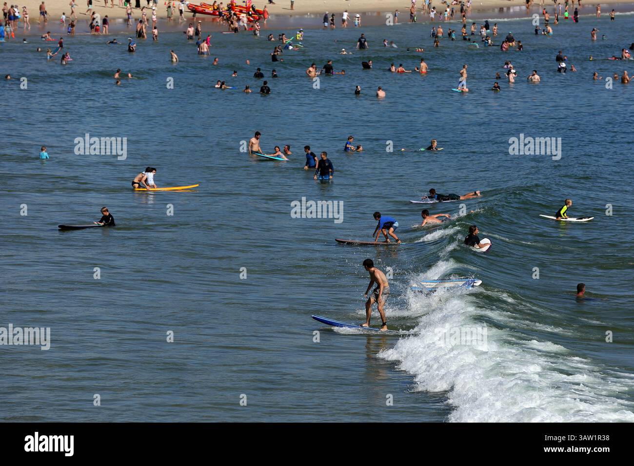 Beachgoers are seen at Noosa Main Beach during the Easter long weekend ...