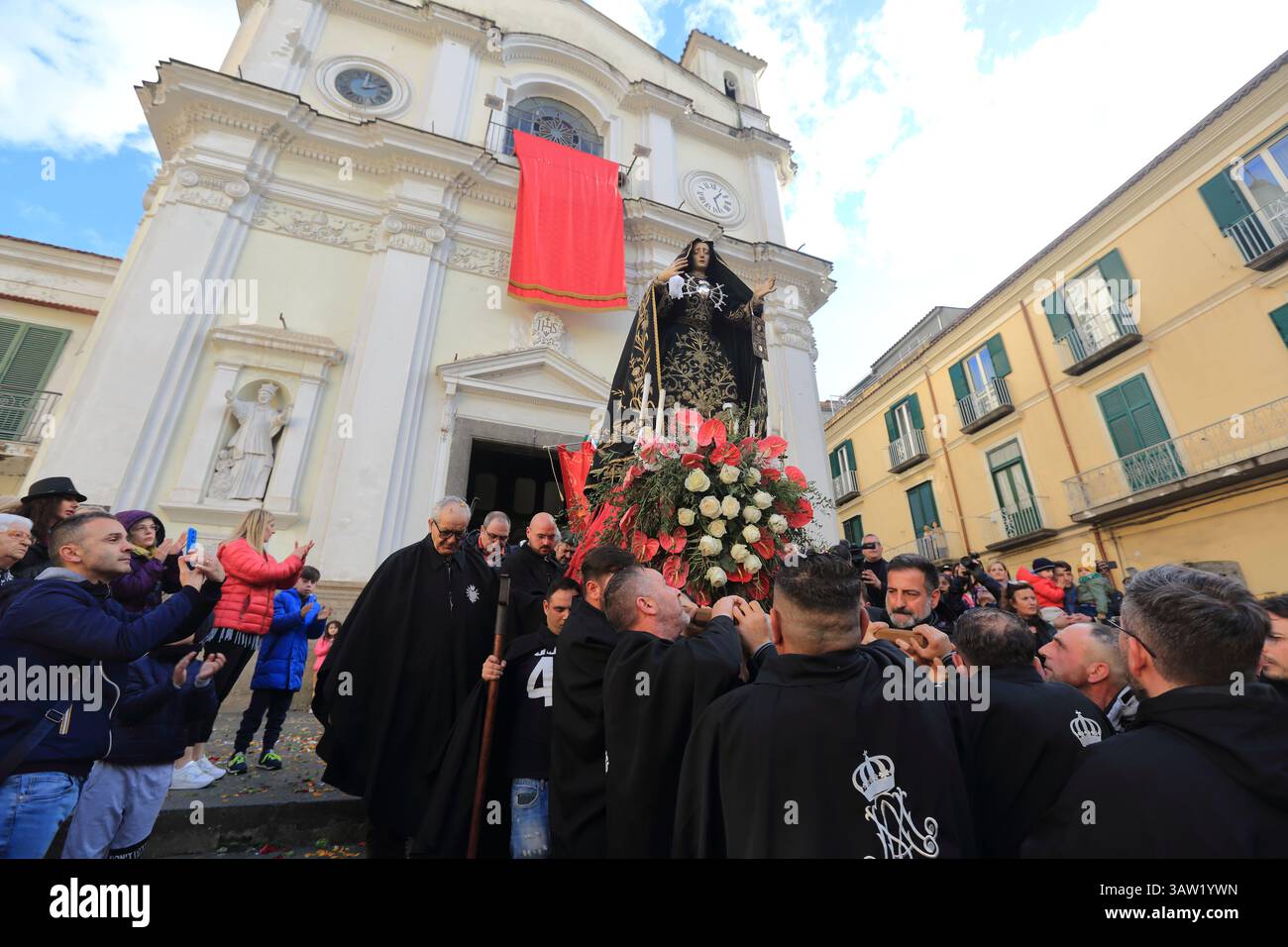 Faithful seen in procession through the historic center on Friday of ...