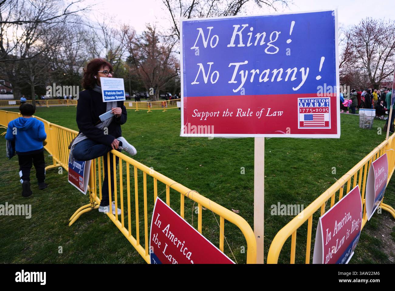 A lone protestor sits in the "Free Speech Zone" during a reenactment ...