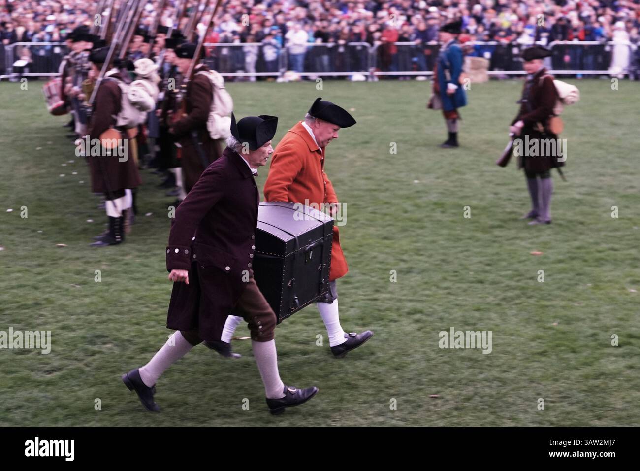 Colonial men carry the papers of John Hancock away from the advancing ...
