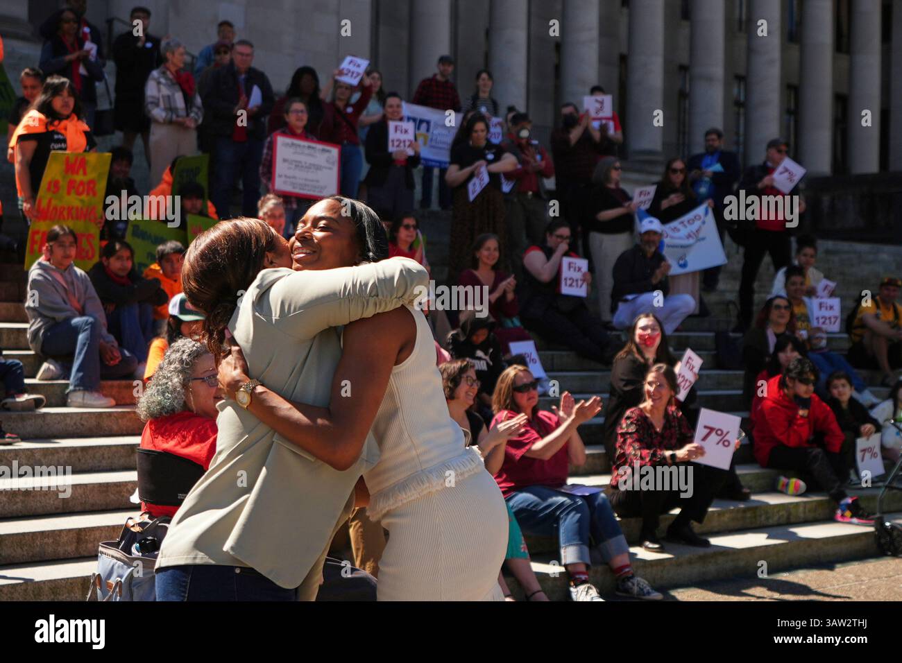 Sen. T'wina Nobles, D-Fircrest, facing, gets a hug during a rally ...