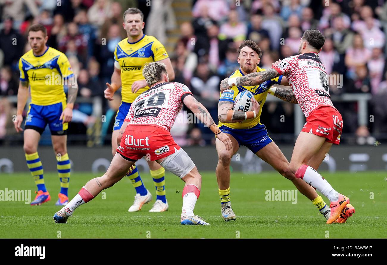 Warrington Wolves' Matty Ashton is tackled by Leigh Leopards' Ethan O ...