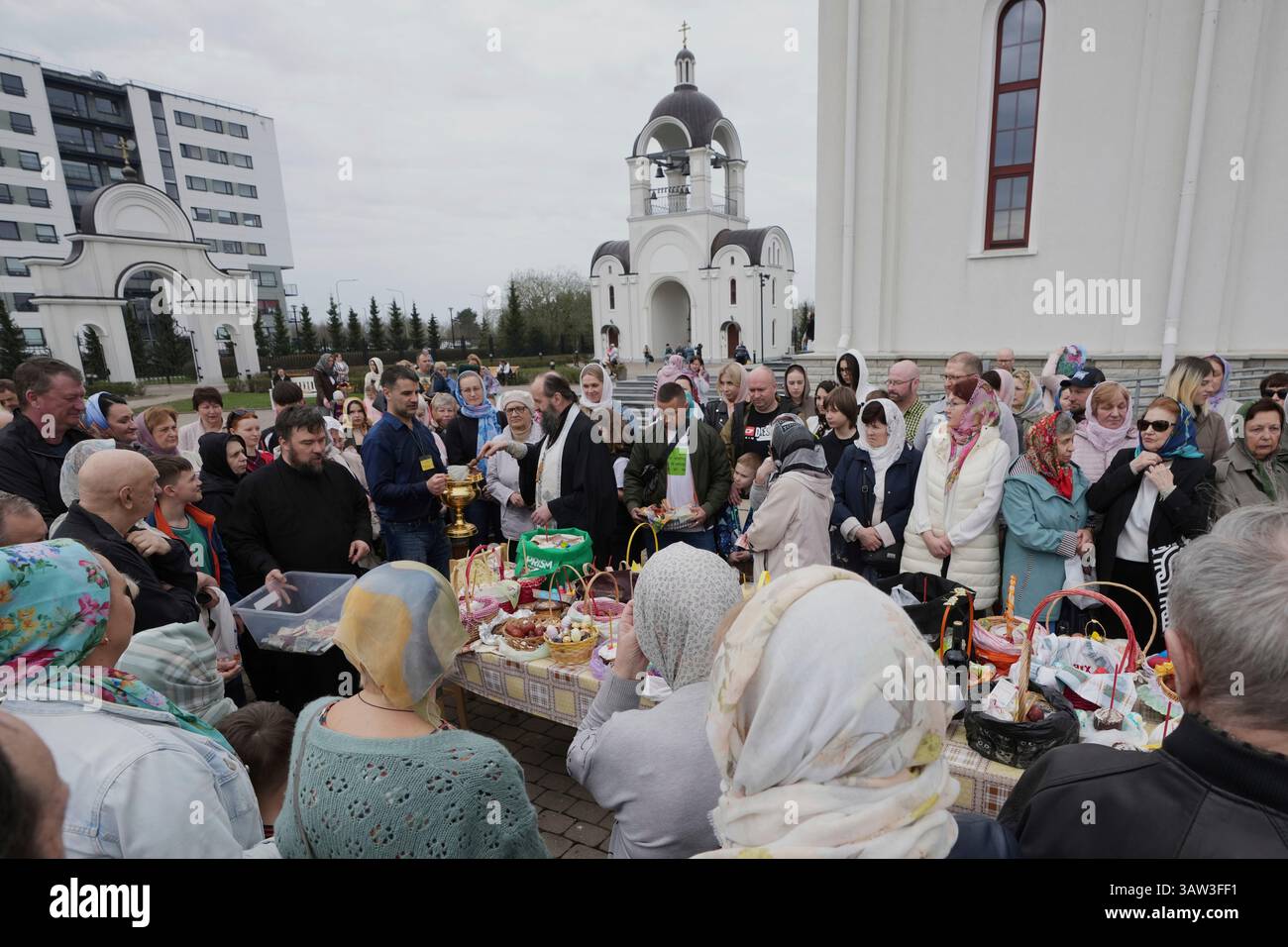 Orthodox priest Father Nikolai blesses believers and their traditional ...