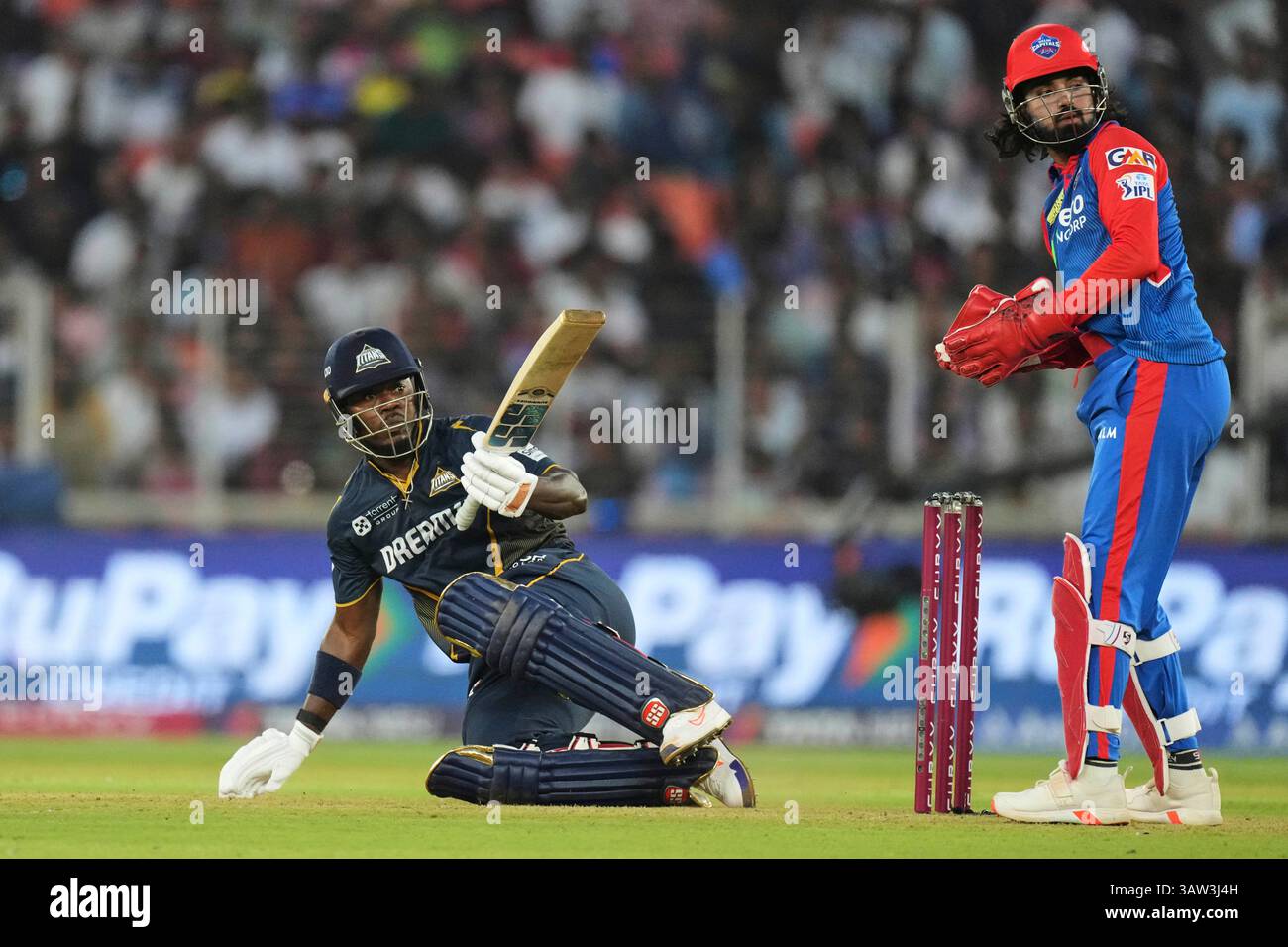 Gujarat Titans' Sherfane Rutherford plays a shot during the Indian ...