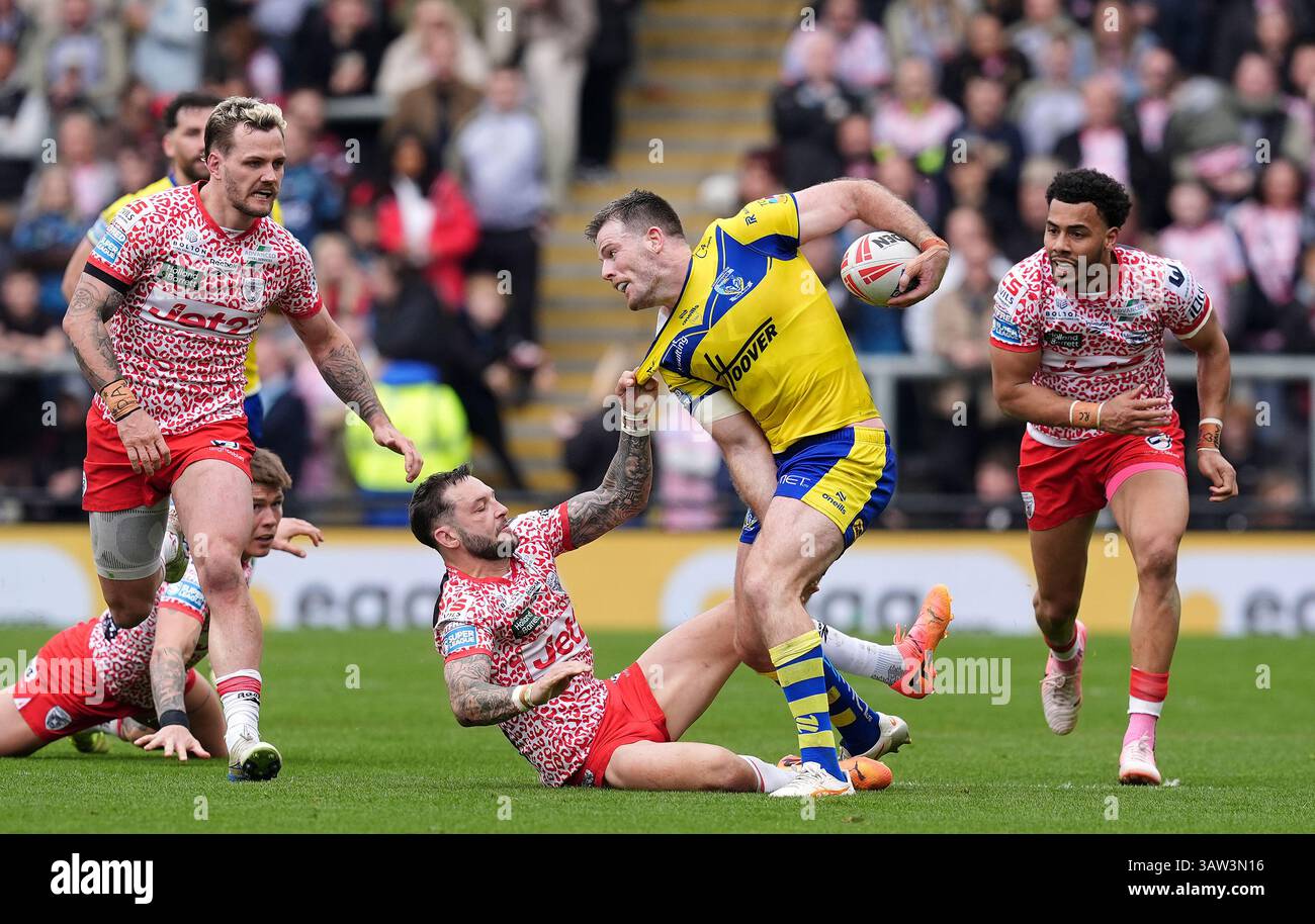 Warrington Wolves' Lachlan Fitzgibbon is tackled by Leigh Leopards ...