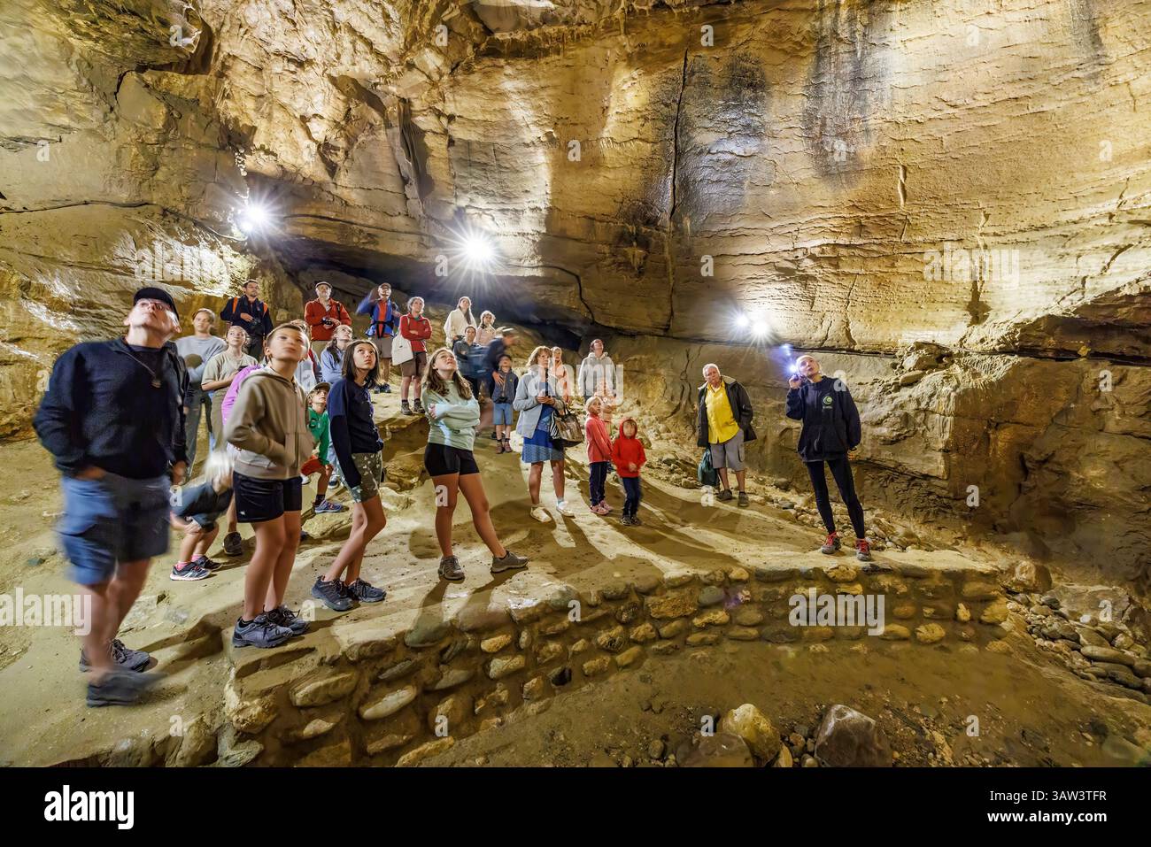 Guide with tour group in the Grottes de Saint-Christophe, Saint ...