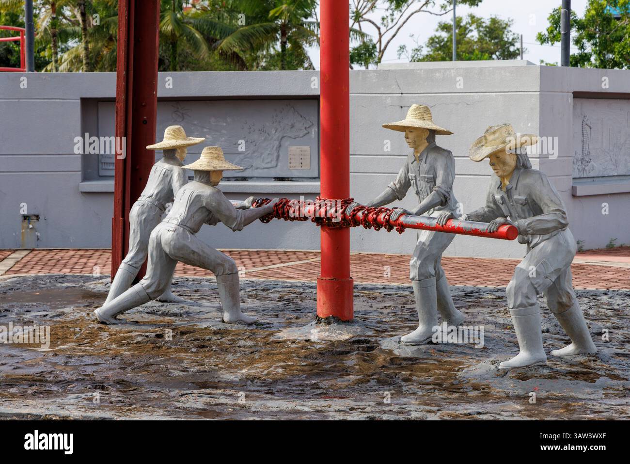 Model workers at the base of the Grand Old Lady oil drilling derrick ...