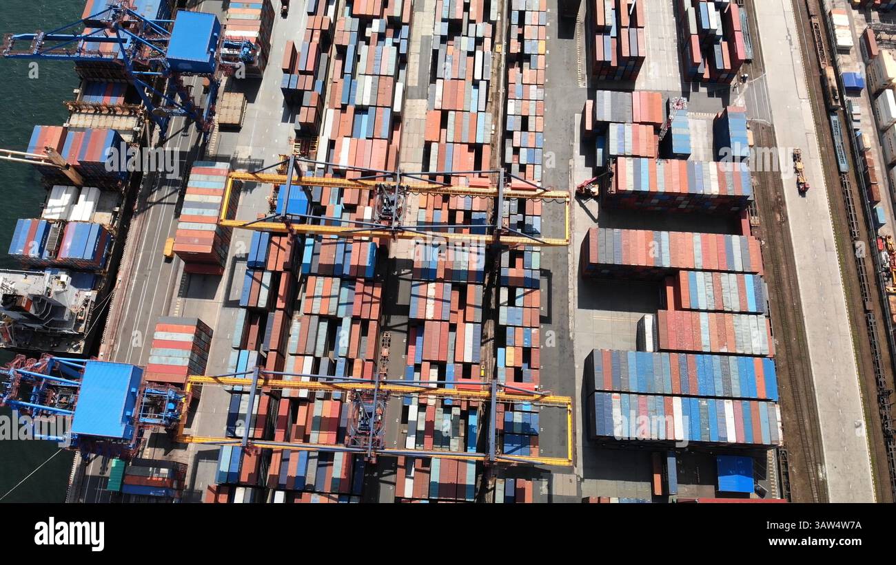 Aerial perspective revealing cargo vessel loading operations at ...
