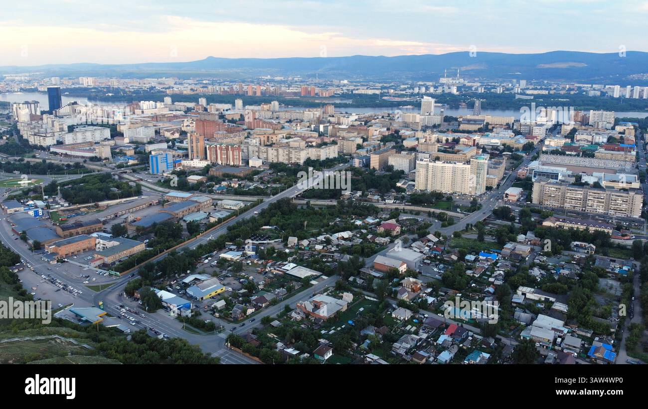 Aerial panorama revealing krasnoyarsk cityscape, spanning yenisei river ...