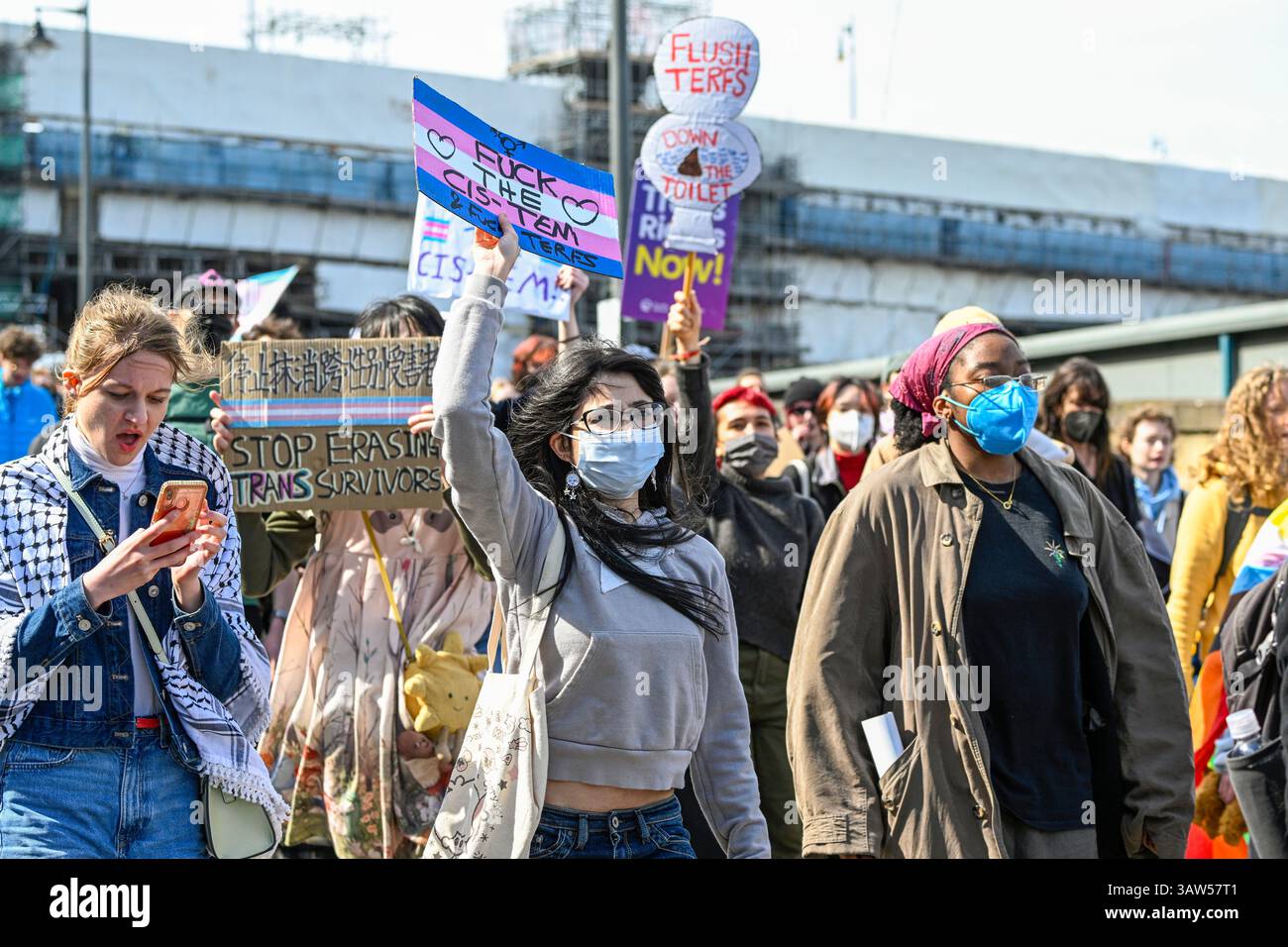 EDITORS NOTE LANGUAGE ON PLACARD People from trans rights groups and ...