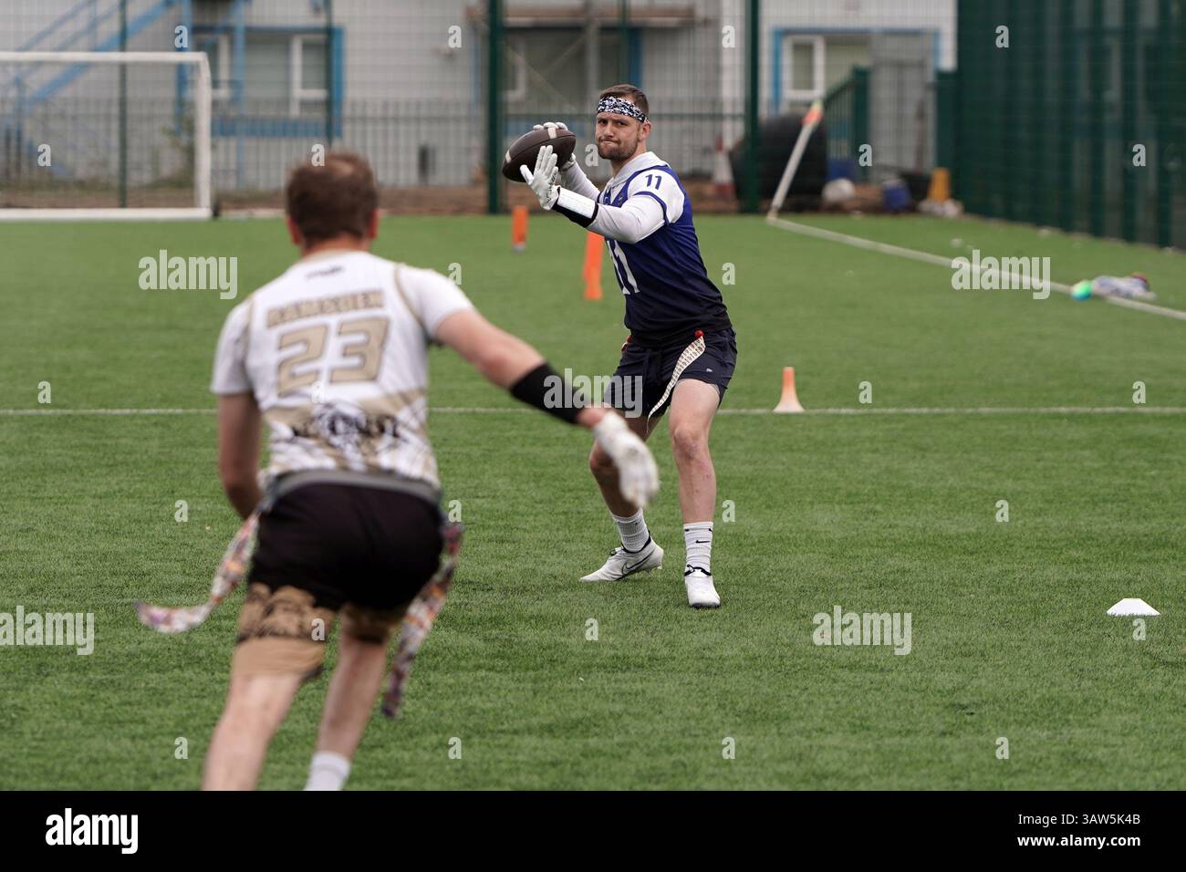 Quaterback throwing the ball during flag football games in Cardiff ...