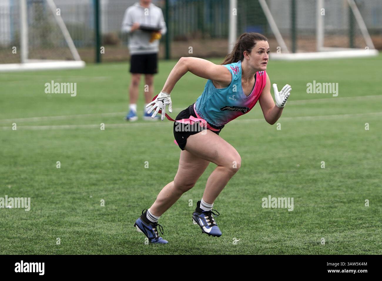 Female pass rusher during flag football games in Cardiff Wales, April ...