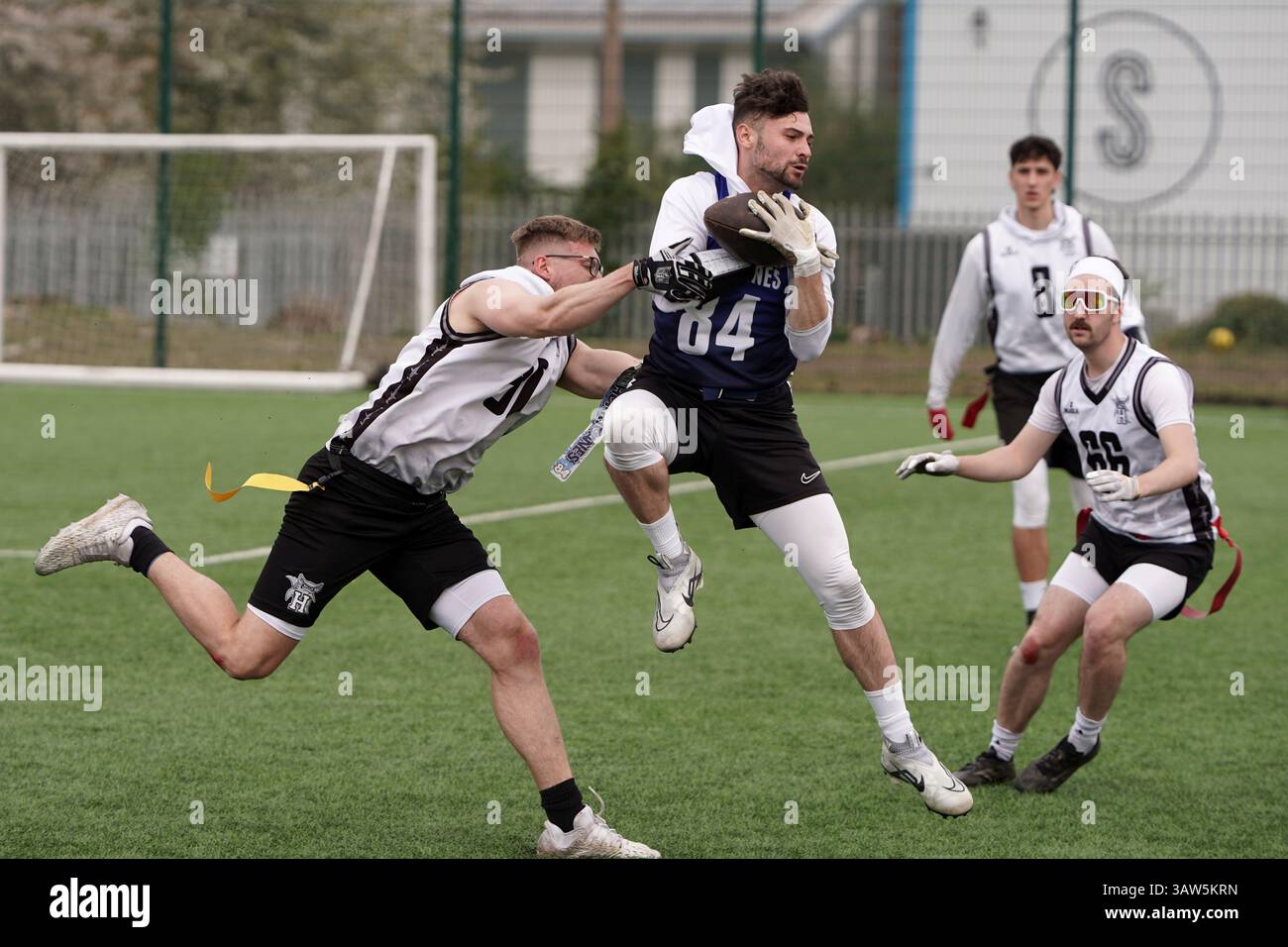 Recievers catching passes during flag football games in Cardiff Wales ...