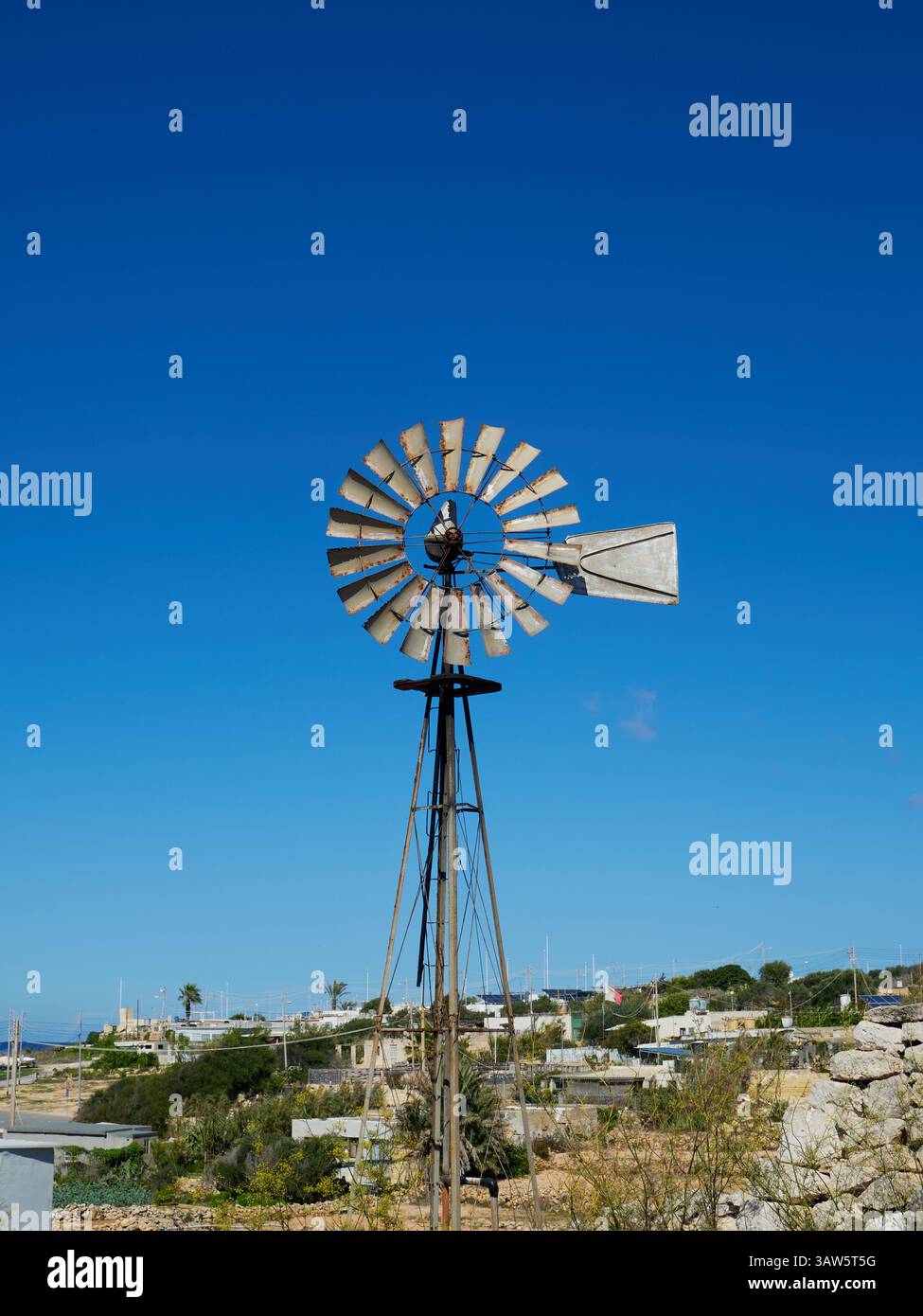 Classic vintage style windmill used on farms Stock Photo - Alamy
