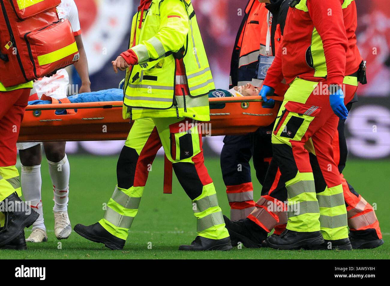 Leipzig goalkeeper Peter Gulacsi is carried off the pitch during the ...