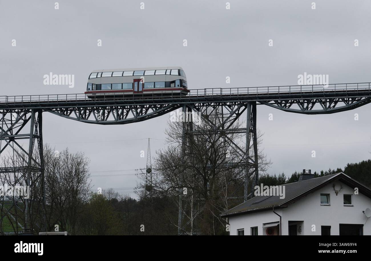 Markersbach, Germany. 19th Apr, 2025. The BR 670 "Alma" double-decker railbus crosses the ...