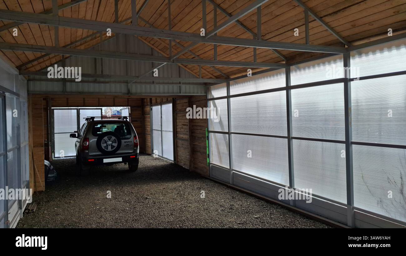 Moscow region, Russia - April 12, 2025:Suv parked in wooden structure ...
