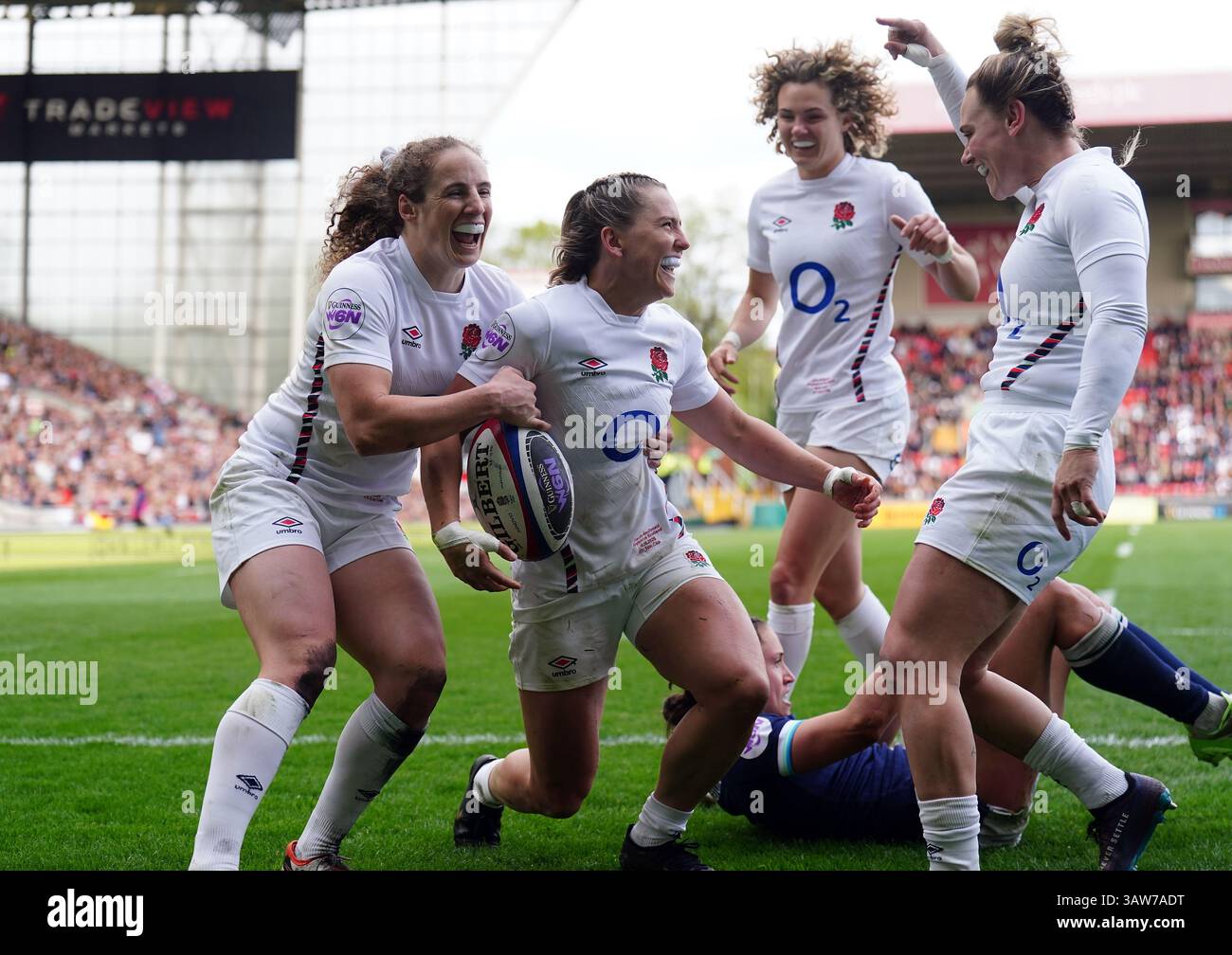 England's Claudia MacDonald celebrates scoring a try during the ...