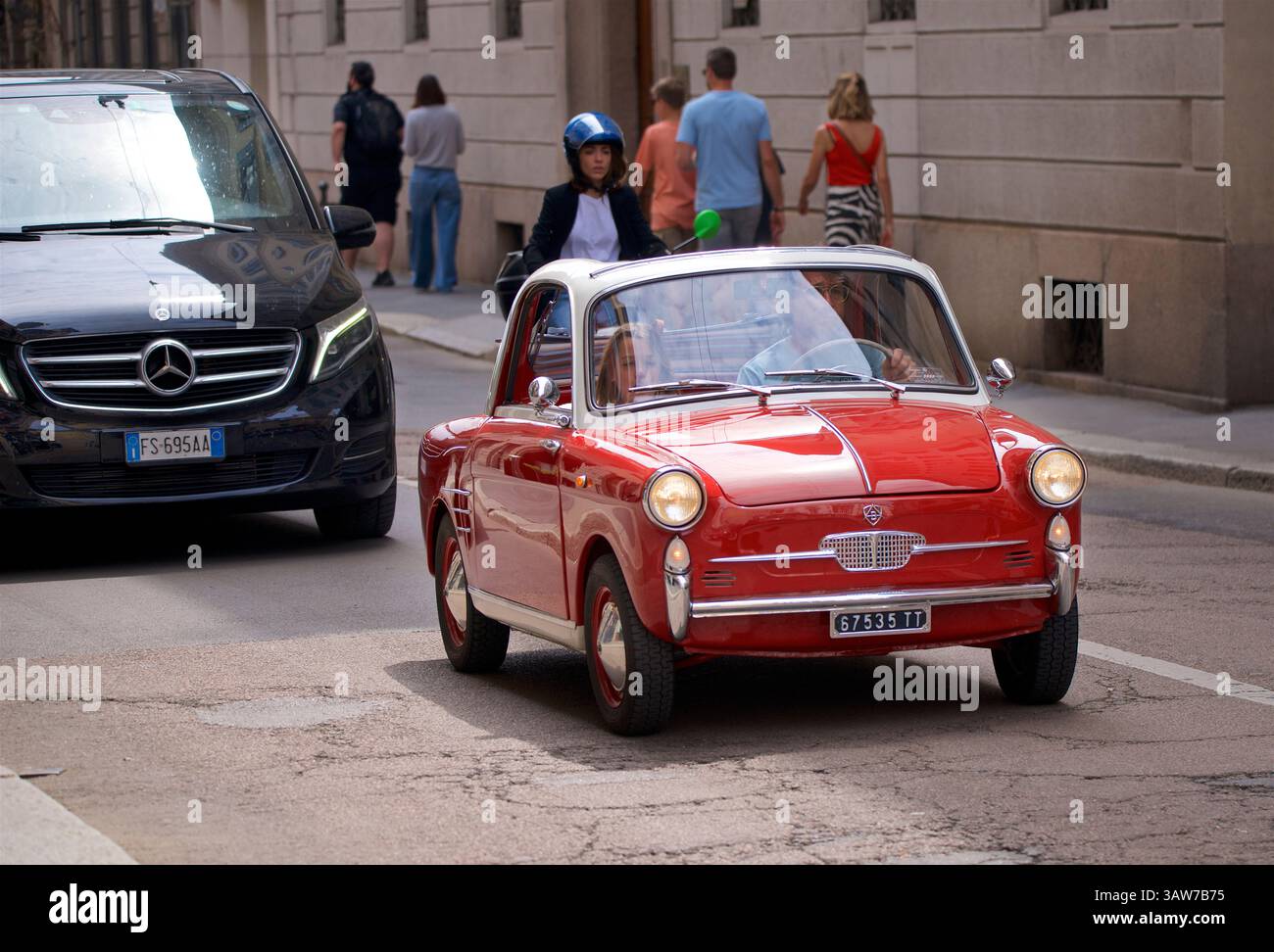A red Autobianchi Bianchina in central Milan, Italy. Based on the Fiat ...