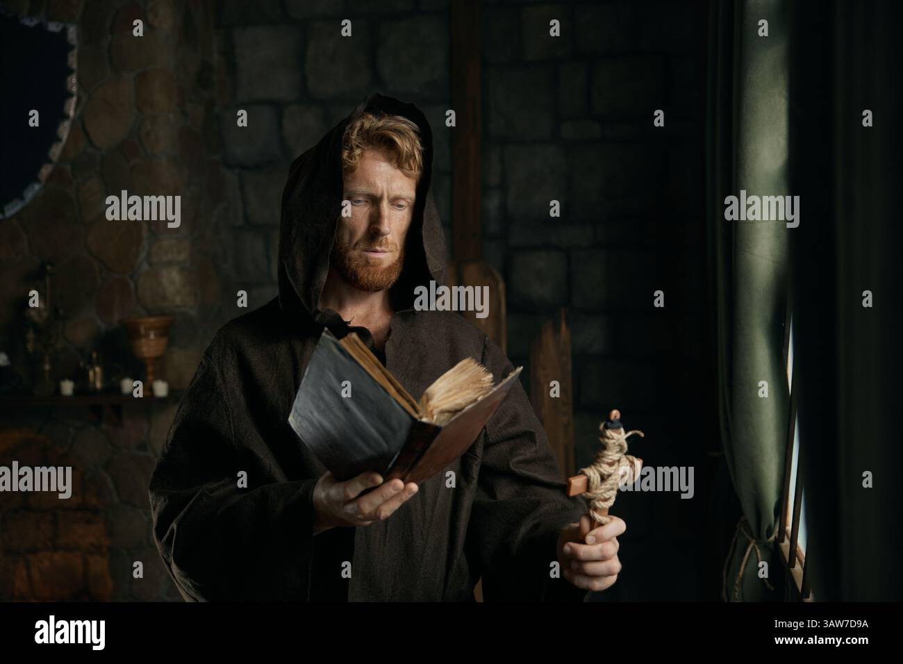 Thoughtful medieval monk reading ancient book in cathedral Stock Photo ...
