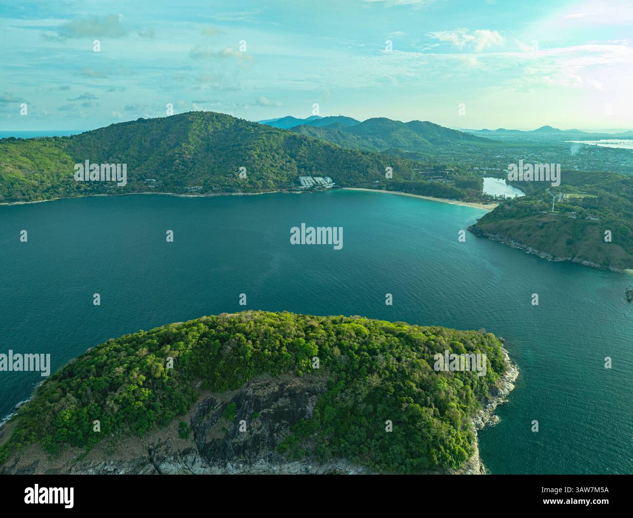 Aerial view Man island is in front of Phrom Thep. The sky is filled ...