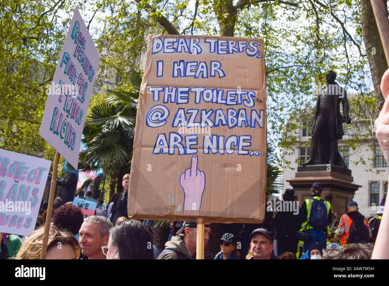 London, England, UK. 19th Apr, 2025. A protester holds a sign with a ...