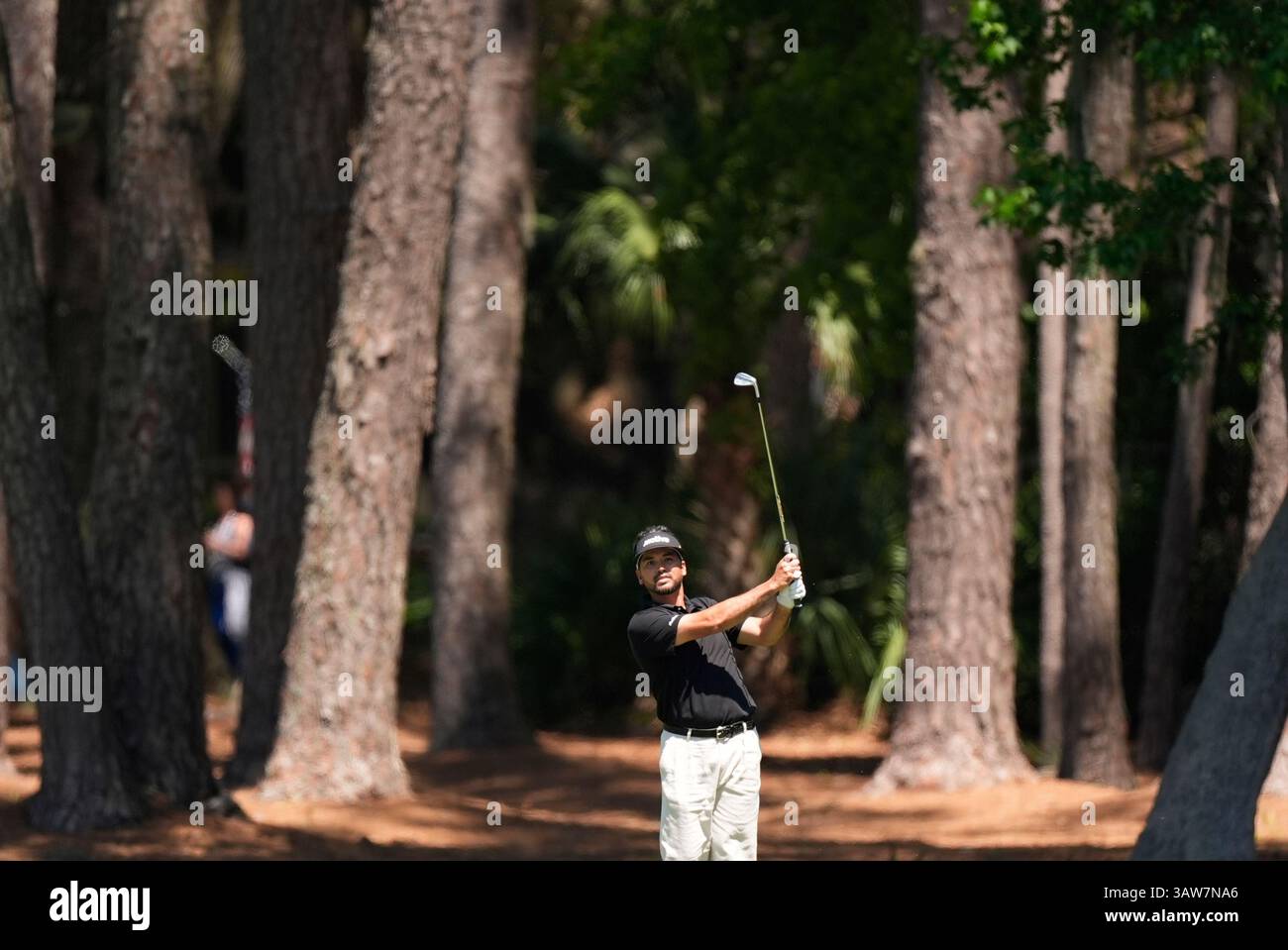Jason Day watches his shot from the fairway on the second hole during ...