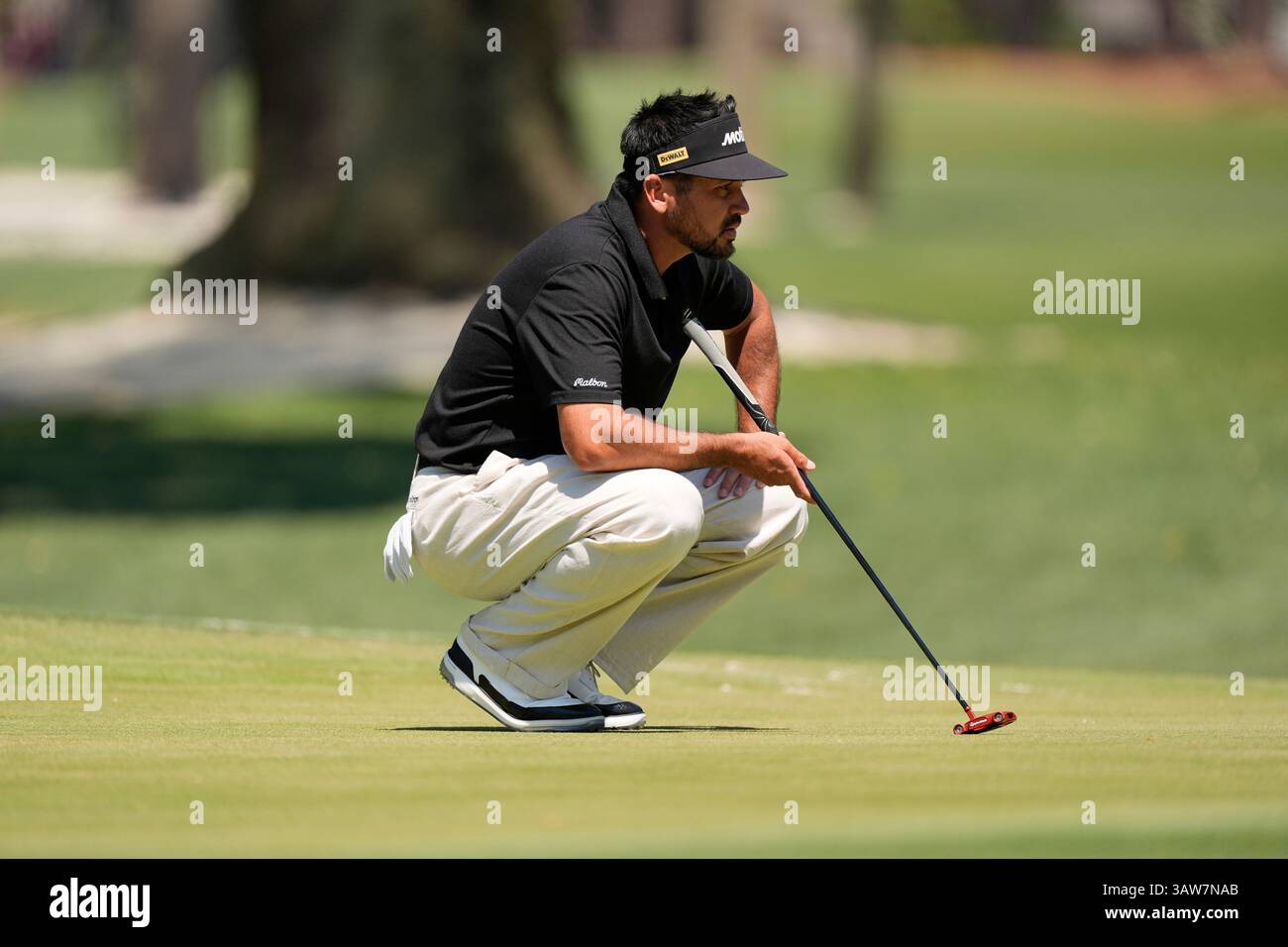 Jason Day lines up a shot on the second hole during the third round of ...