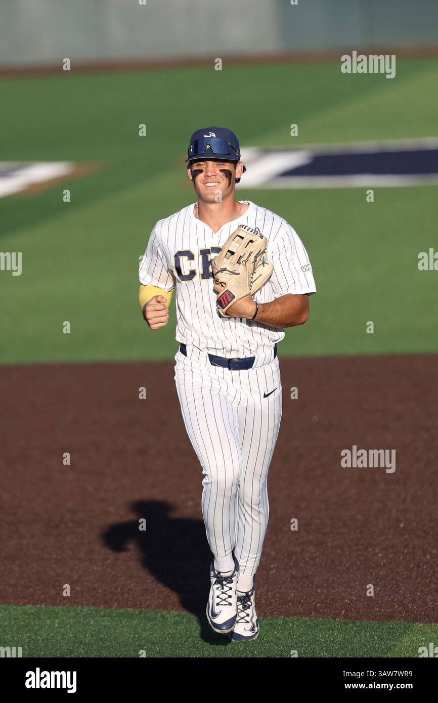 Nick Dumesnil (22) of the Cal Baptist Lancers returns to the dugout ...