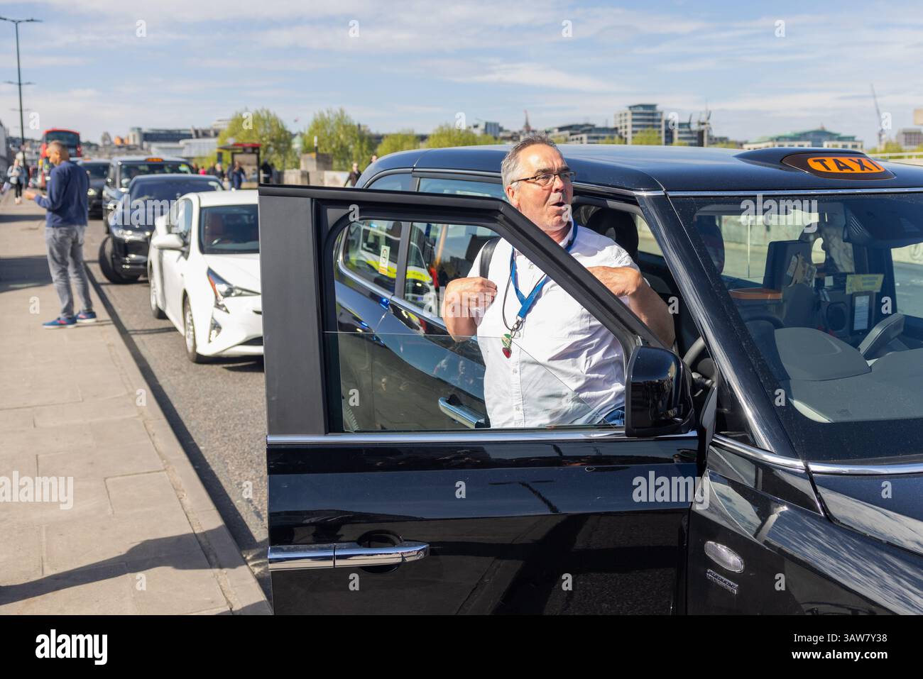 London, UK. 19 APR, 2025. Taxi driver pretends to be a chicken in ...