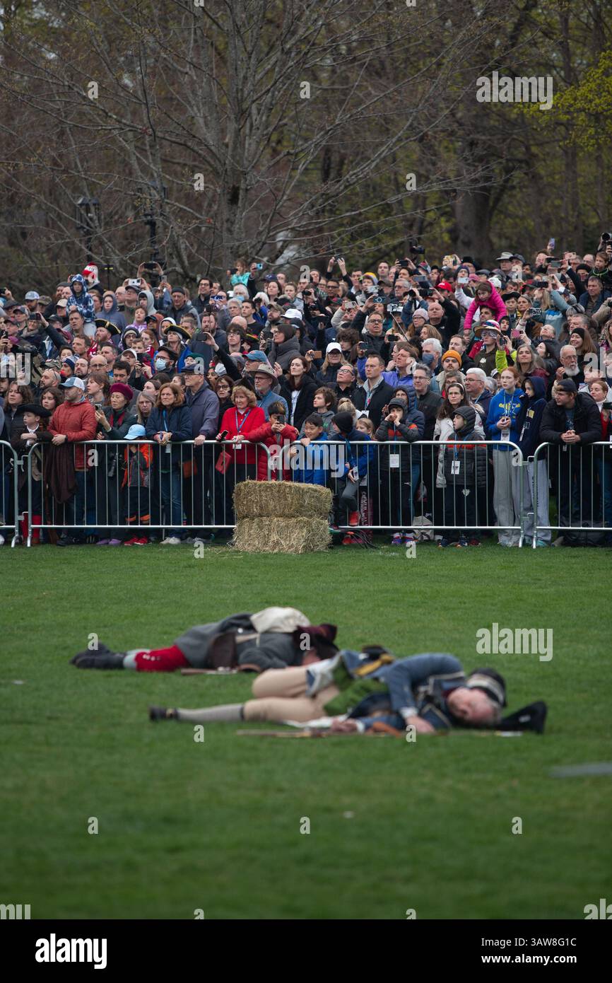 Lexington, USA. 19th Apr, 2025. Spectators watch a reenactment at the ...