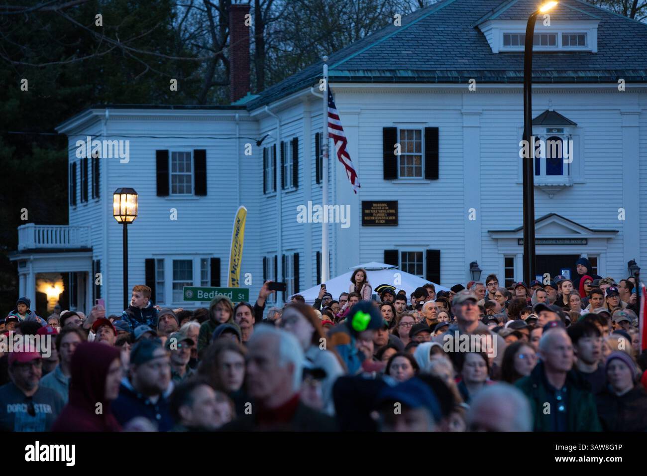 Lexington, USA. 19th Apr, 2025. Spectators watch a reenactment at the ...