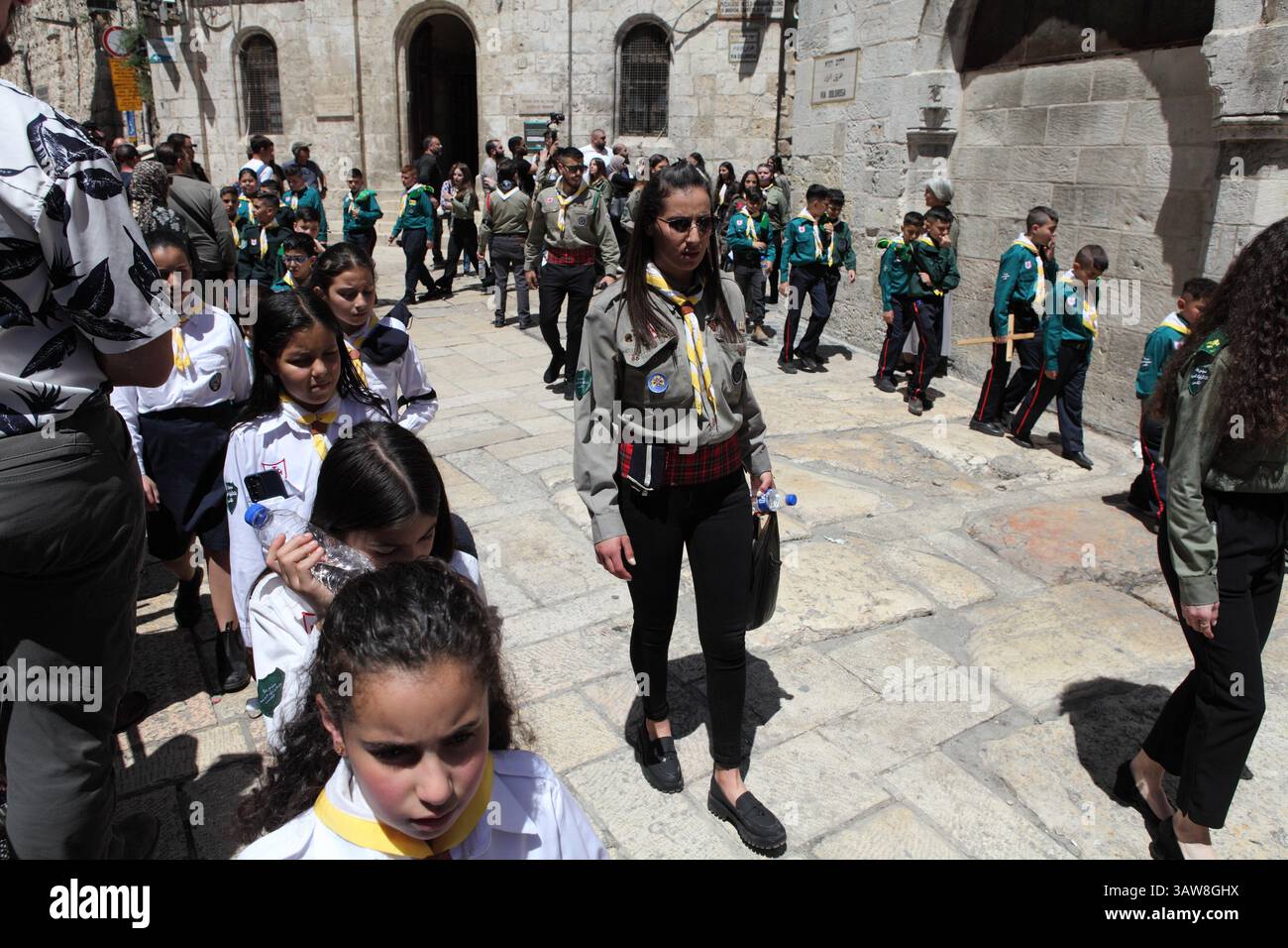 Christian Palestinian Arabs school kids march at the end of the Good Friday Procession ...