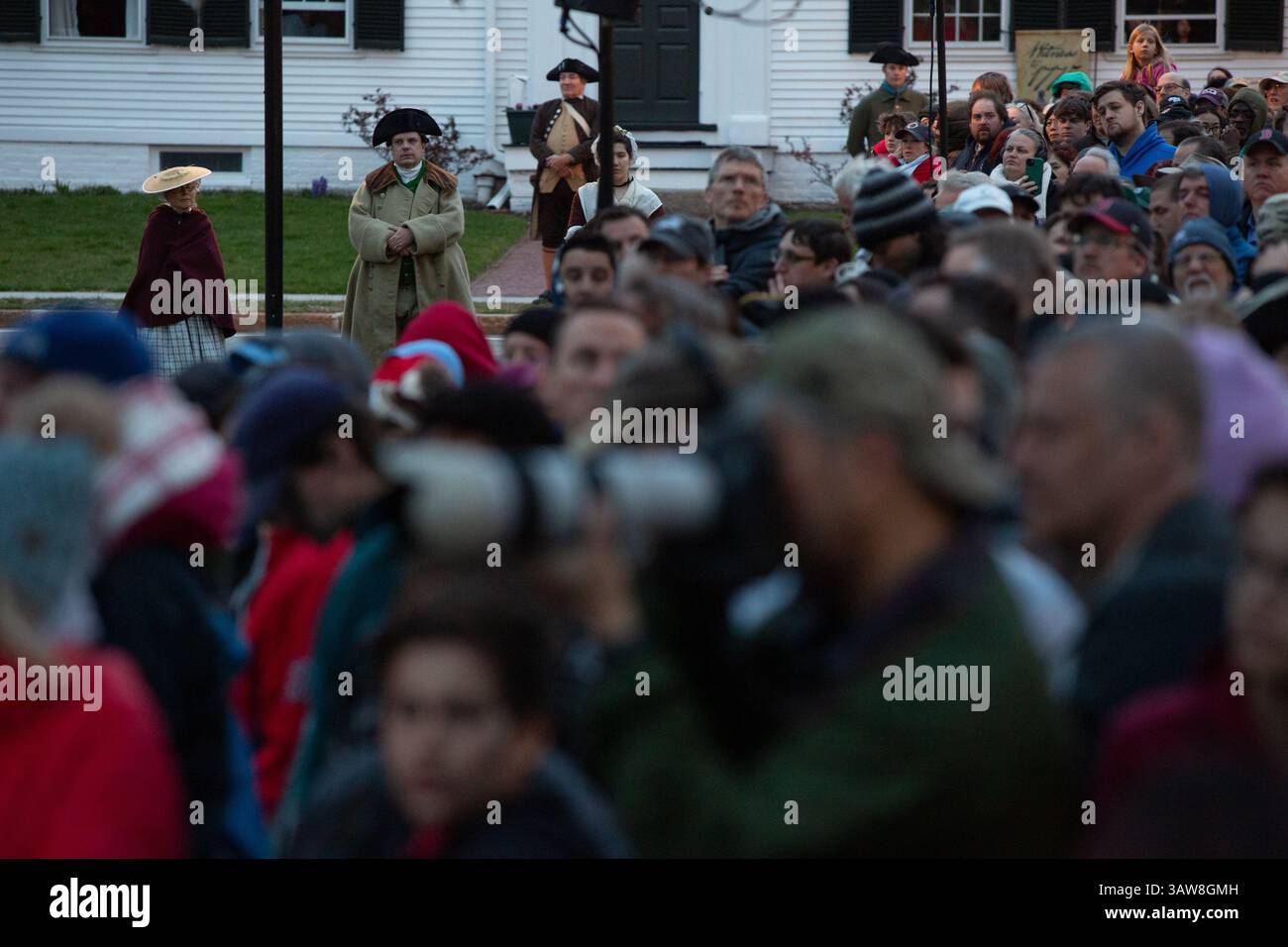 Spectators watch a reenactment at the 250th Anniversary of the Battle ...