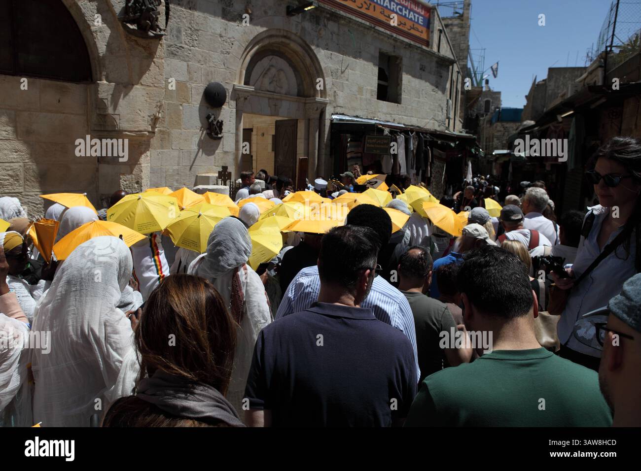 Rear view of Ethiopian Orthodox pilgrims walking in a Good Friday ...
