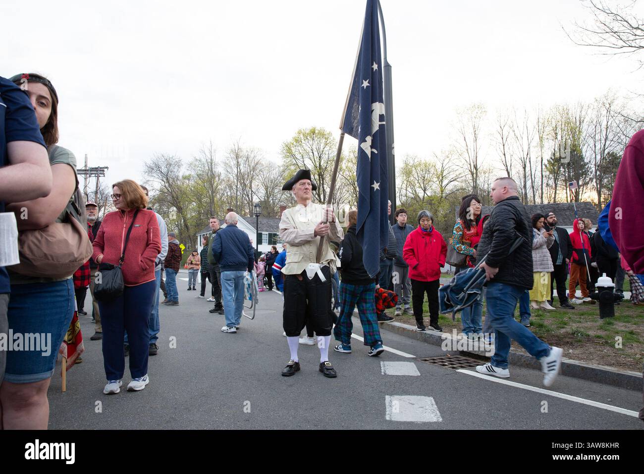 Lexington, USA. 19th Apr, 2025. Spectators attend the reenactment of ...
