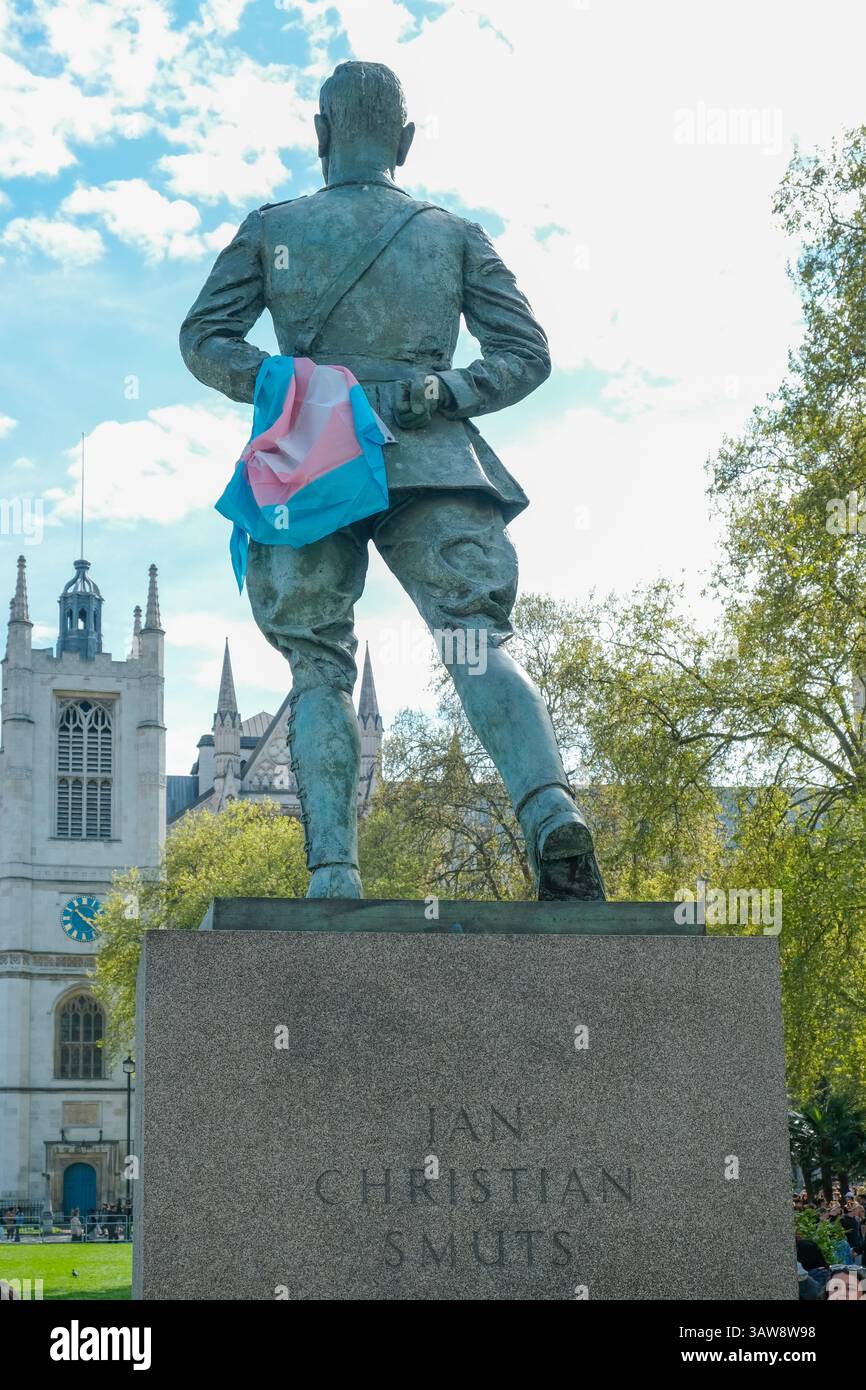 London, UK. 19th April, 2025. Trans flags are tied onto various statues ...