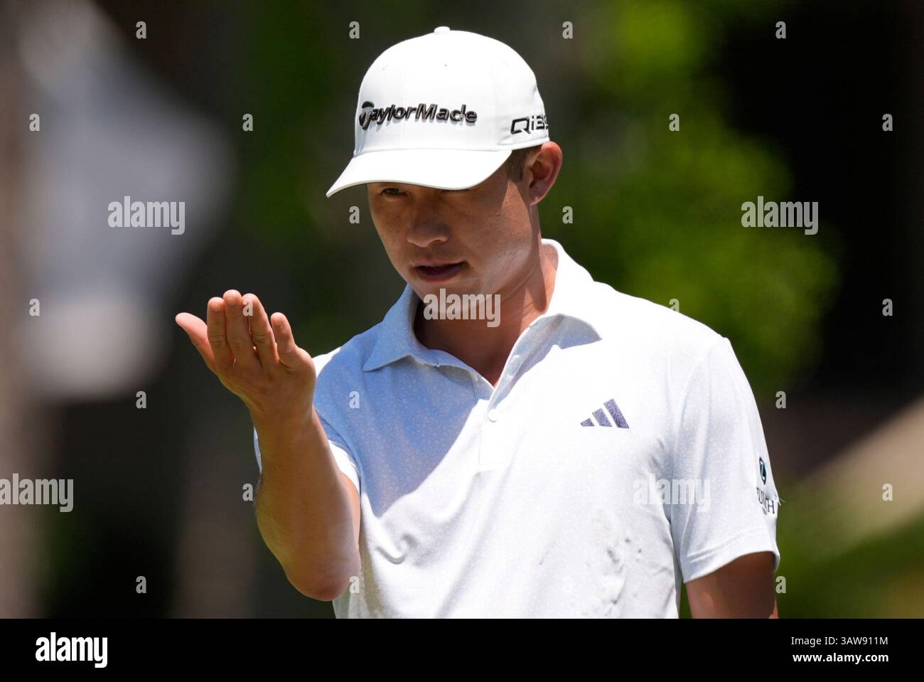Collin Morikawa lines up a putt on the second hole during the third round of the RBC Heritage ...