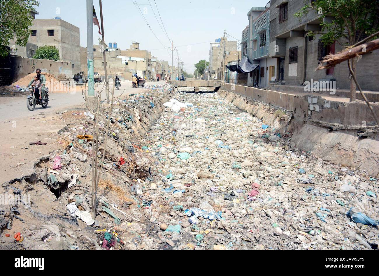 View of open sewerage drain seen covered with heap of garbage, needs ...