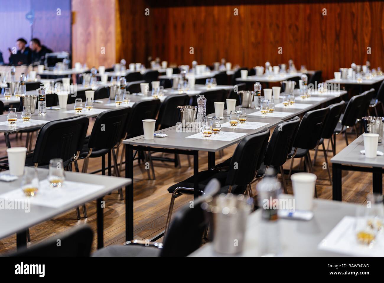 Empty tables set for a whisky tasting event in a cozy venue Stock Photo ...
